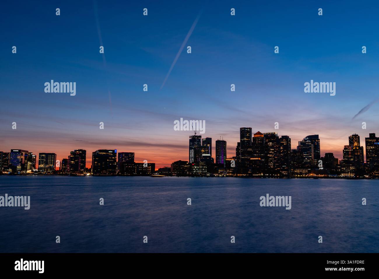 Boston skyline at night with colorful sky Stock Photo - Alamy