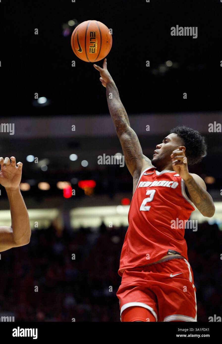 New Mexico guard Donovan Dent shoots over the UNLV defense during the ...