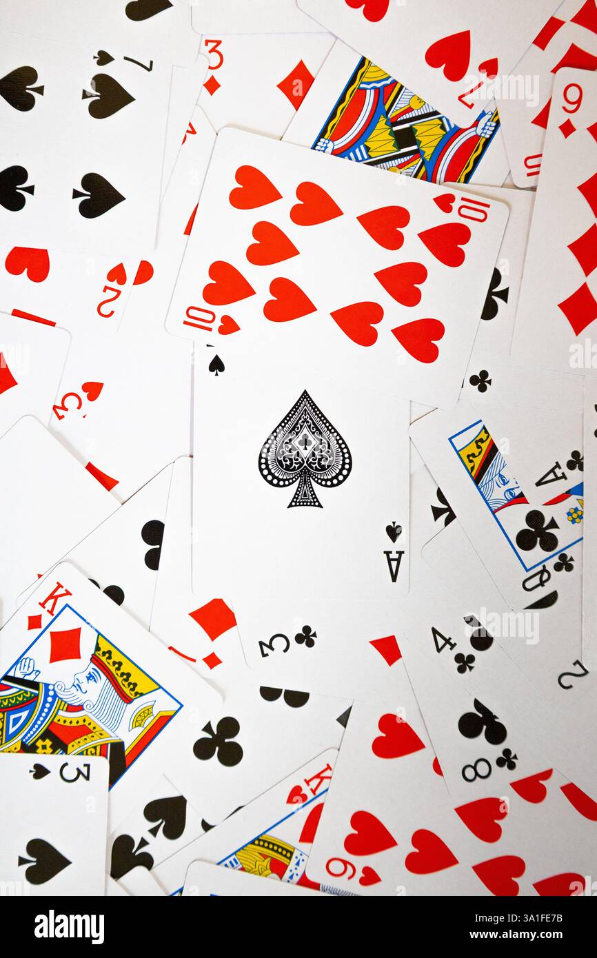 Portrait photo of a deck of cards spread out filling the frame on a ...