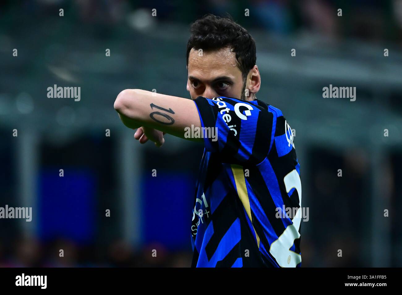 Inter Milan's Turkish midfielder #20 Hakan Calhanoglu looks on during ...
