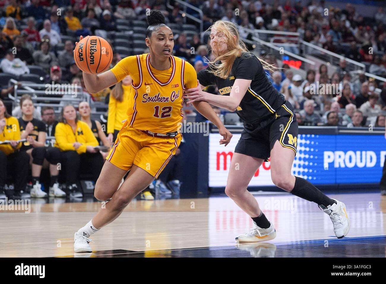 Southern California guard JuJu Watkins (12) drives around Michigan ...