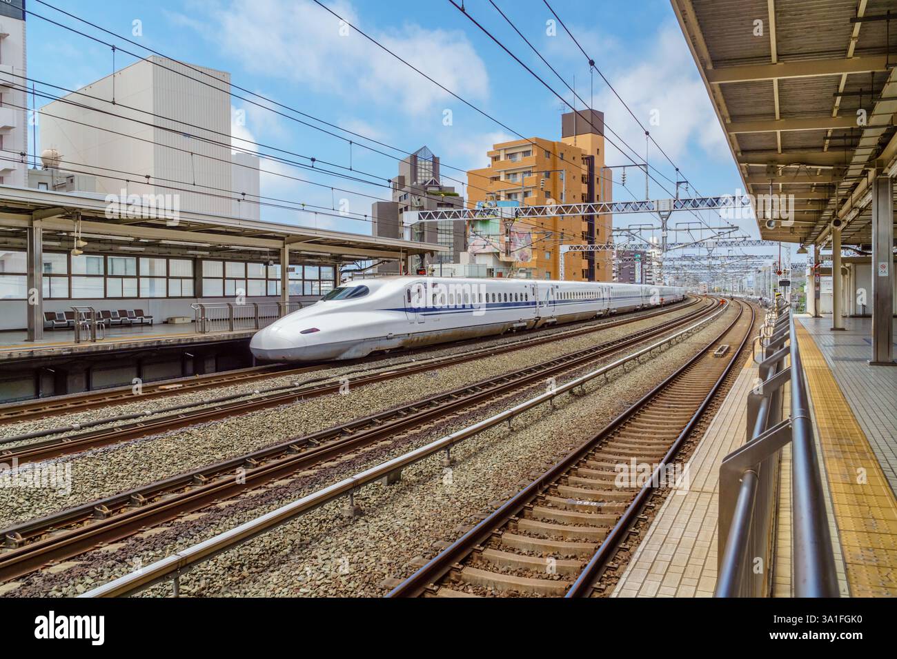 Hamamatsu,Japan - June 27, 2024: White Shinkansen bullet train passing ...