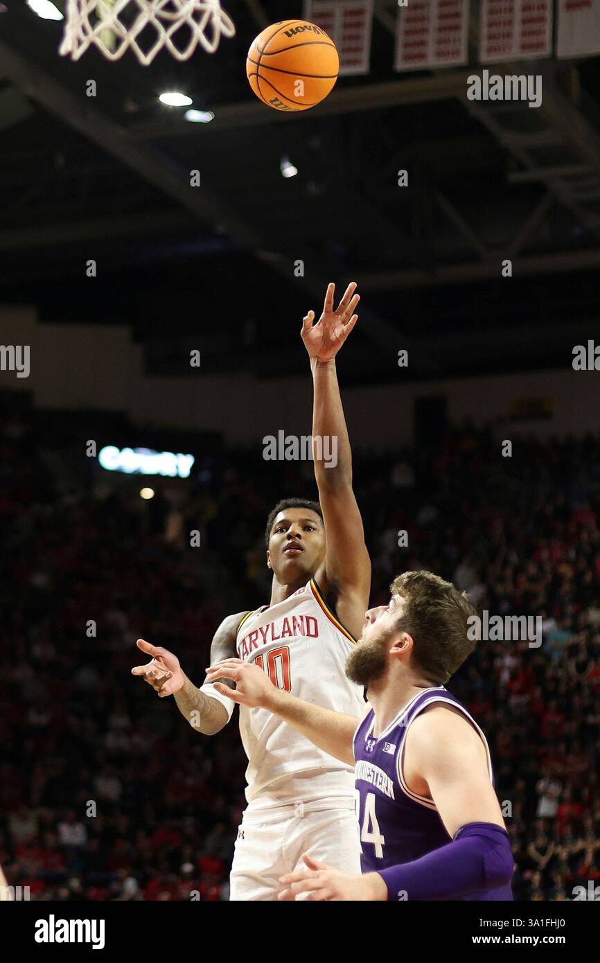 Maryland forward Julian Reese (10) takes a shot over Northwestern center Matthew Nicholson (34 ...