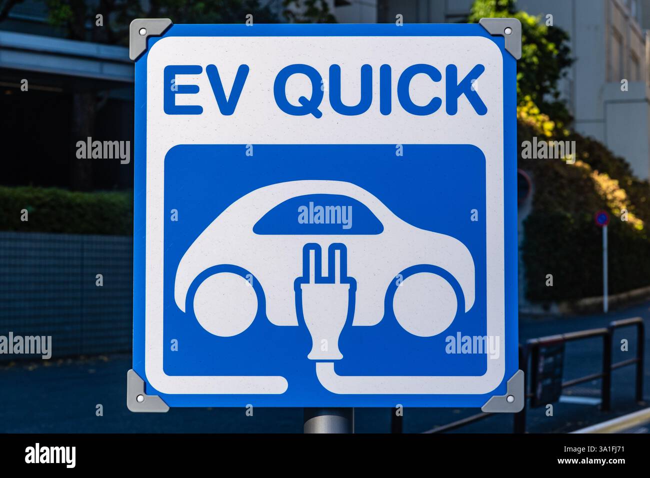 Sign reading 'EV Quick' at an EV (electric vehicle) charging station Stock Photo - Alamy