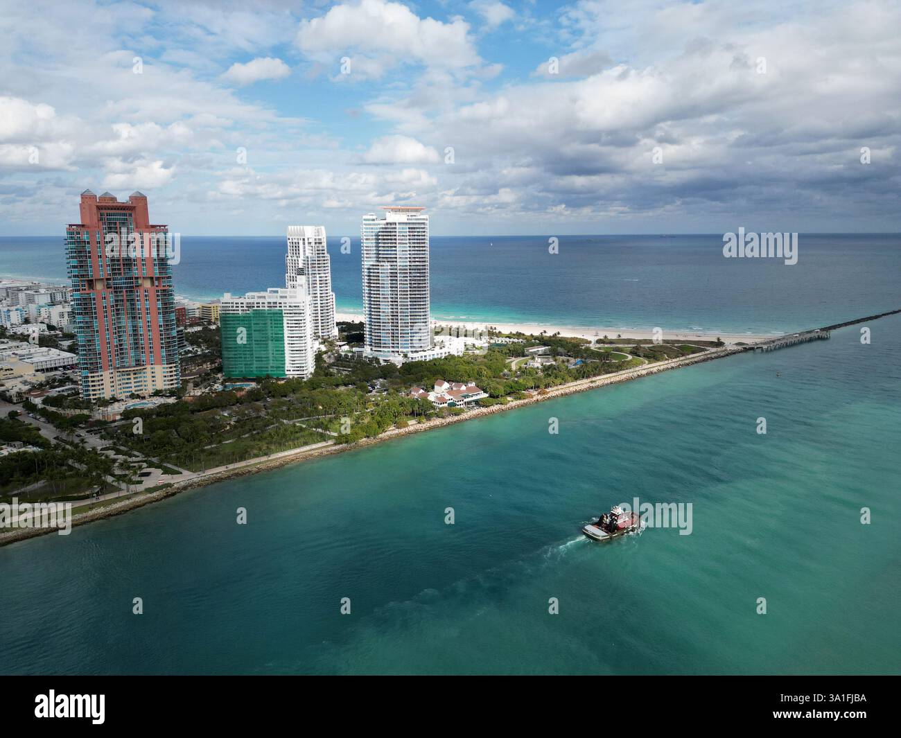 Skyline panorama. Tugboat passing canal. Miami South beach landscape ...