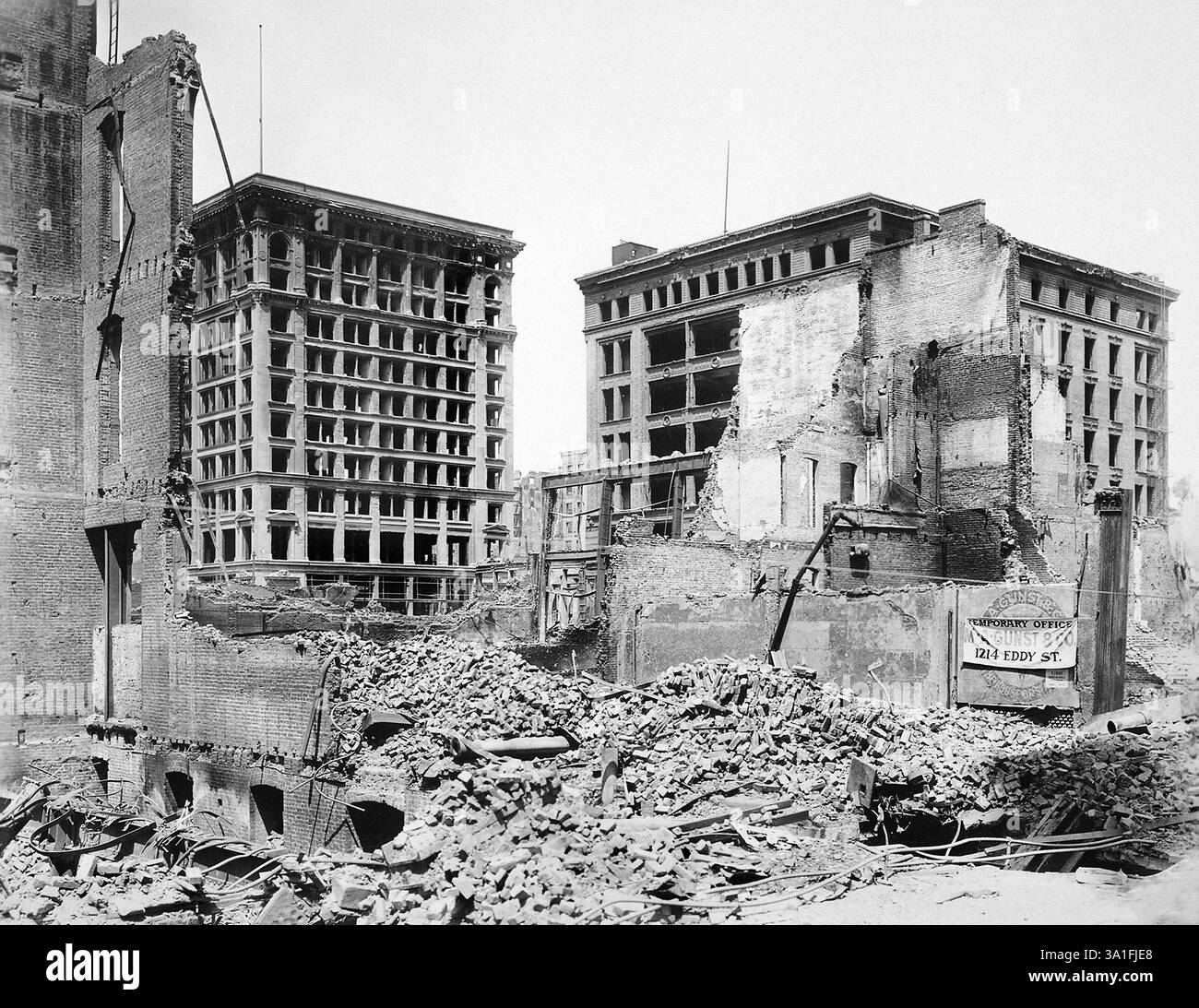 Damaged buildings after earthquake, large building standing is possibly ...