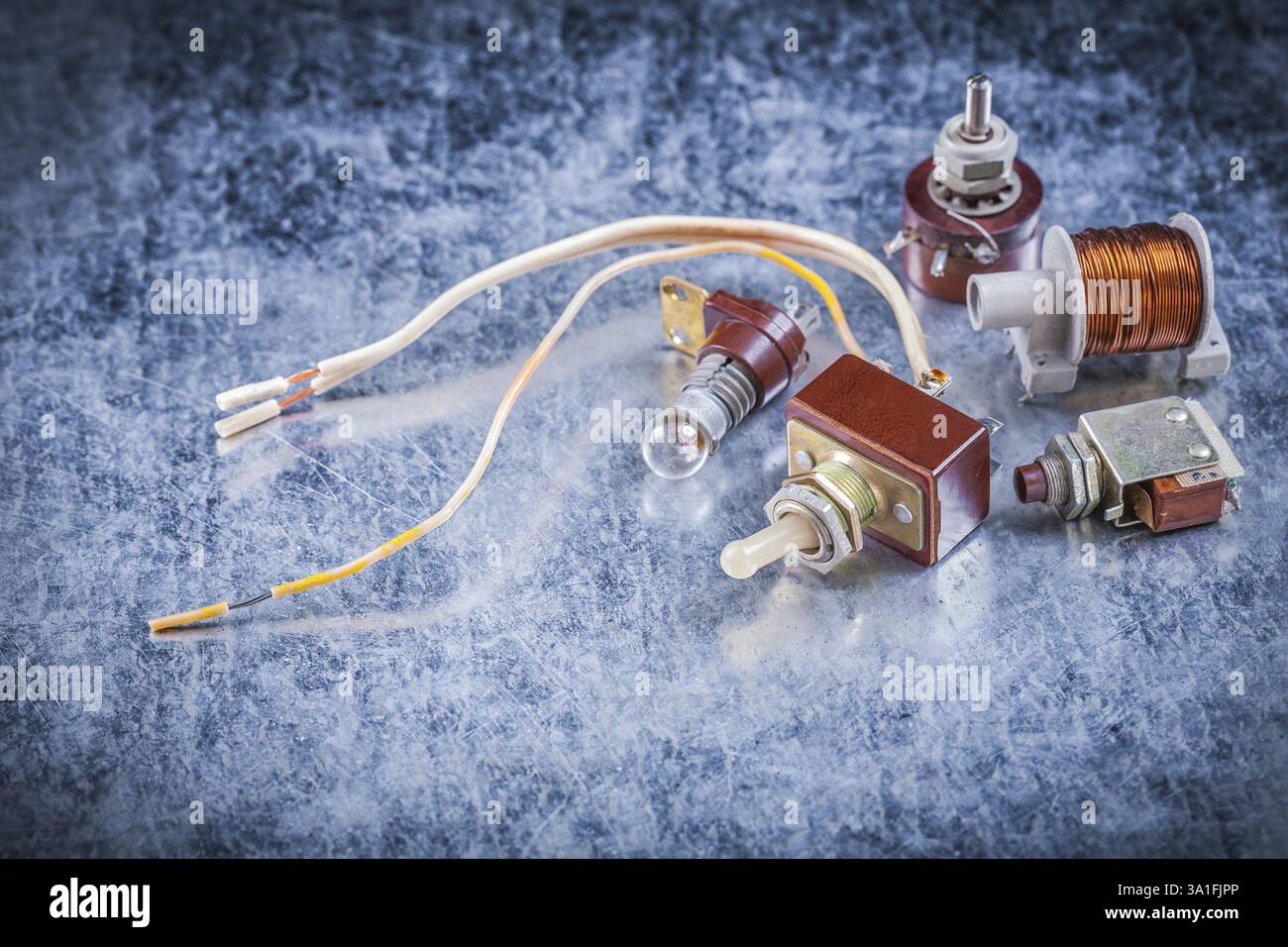 Group of electric devices on metallic background vintage electricity ...