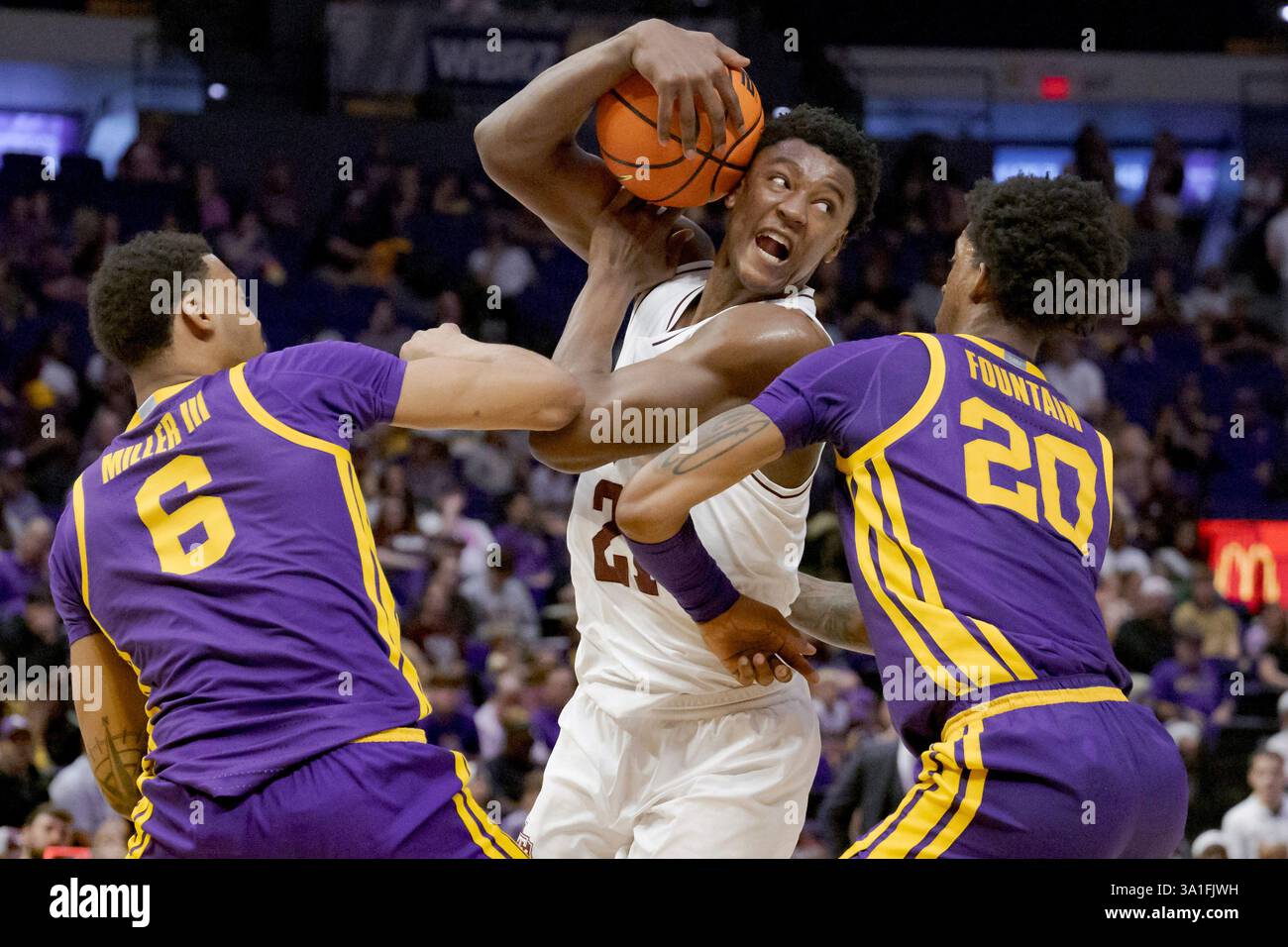 LSU forward Robert Miller III (6), left, Texas A&M forward Pharrel ...