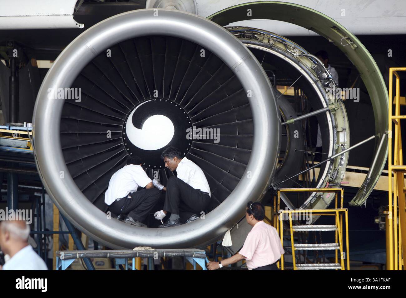 Engineers working on Boeing 747-400 parked for maintenance & repair at ...