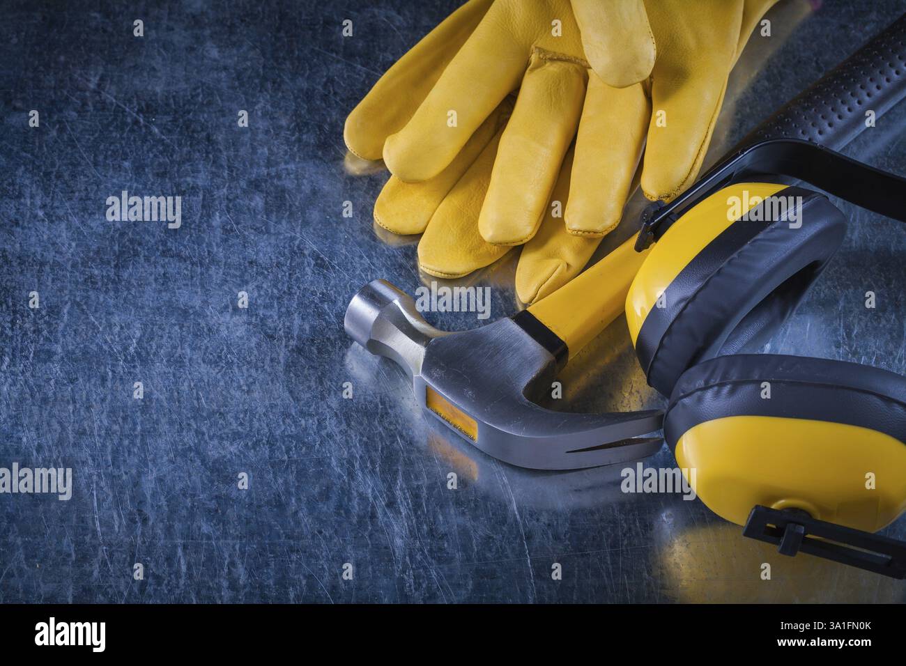 Noise insulation ear muffs claw hammer and leather construction gloves ...