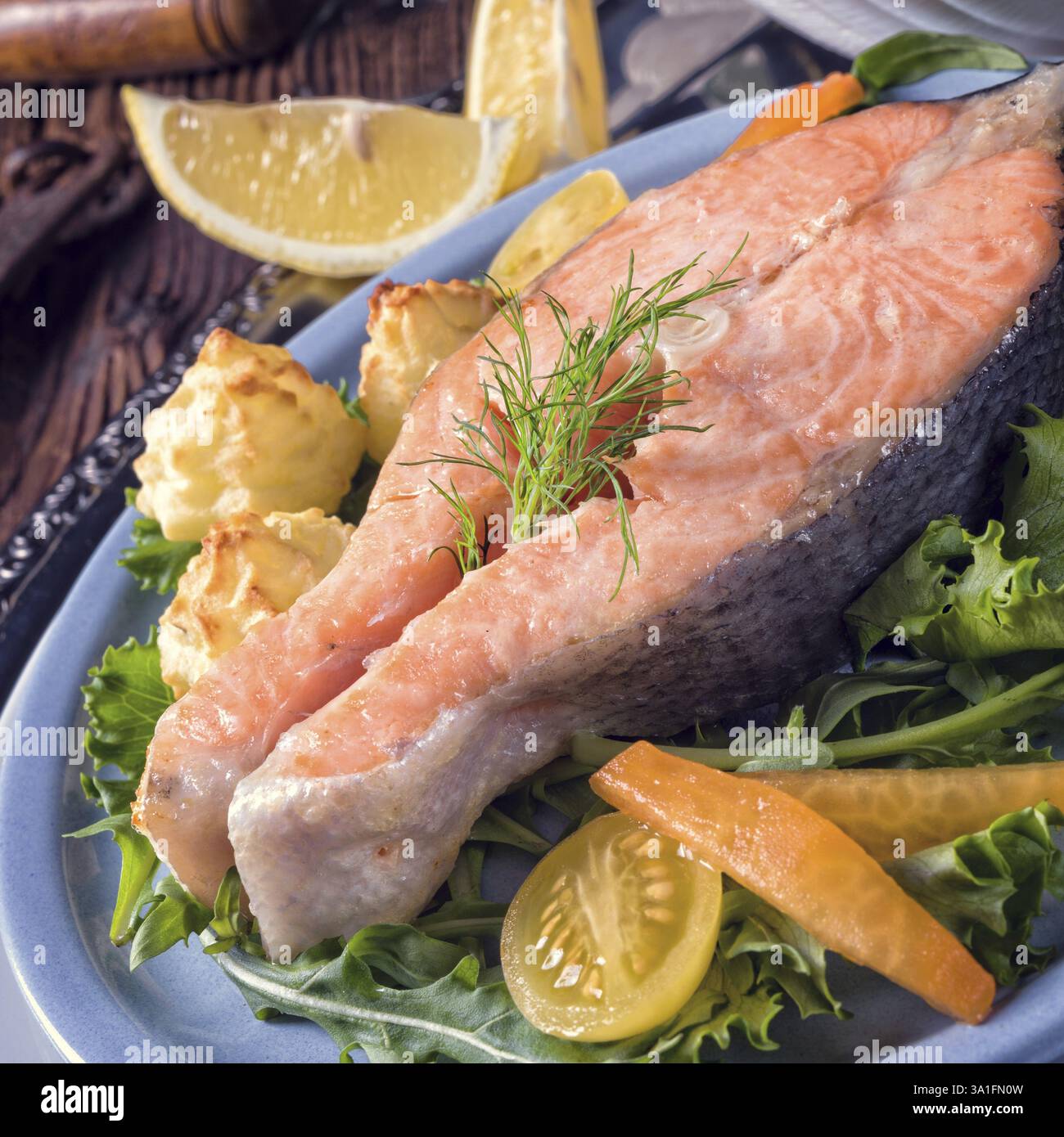 Salmon with butter fried potato puree and salad Stock Photo - Alamy
