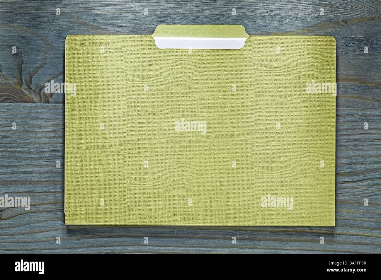 Manila paper folder on wooden board Stock Photo - Alamy
