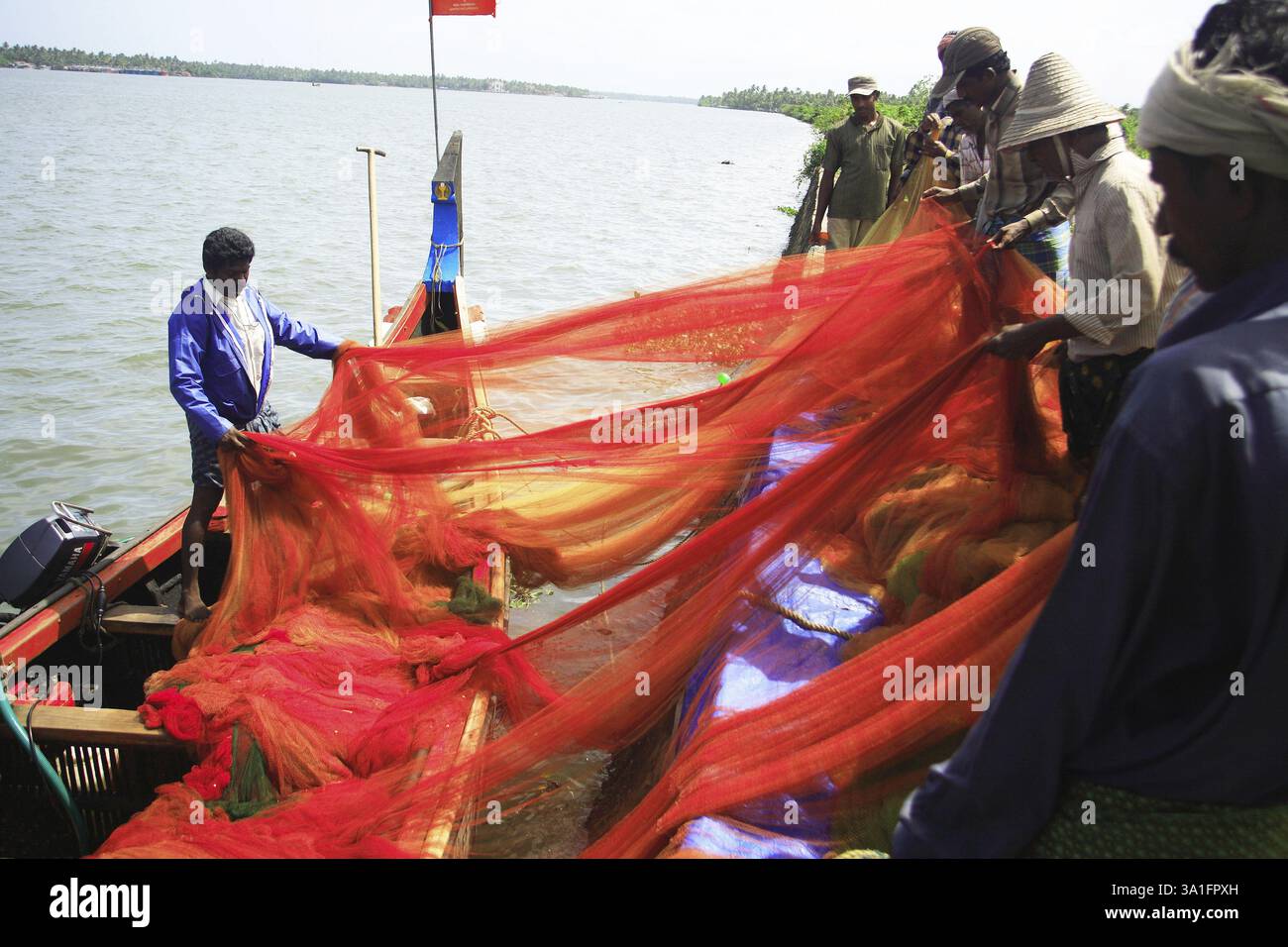 Fishermen cleaning fishnet, Vypeen, Cochin, Kerala, India, Asia Stock ...
