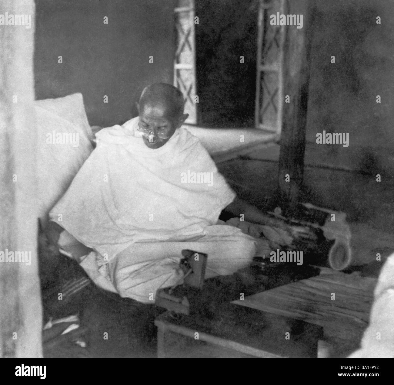 Mahatma Gandhi spinning in his hut at Sevagram Ashram, 1939 NO MR Stock ...
