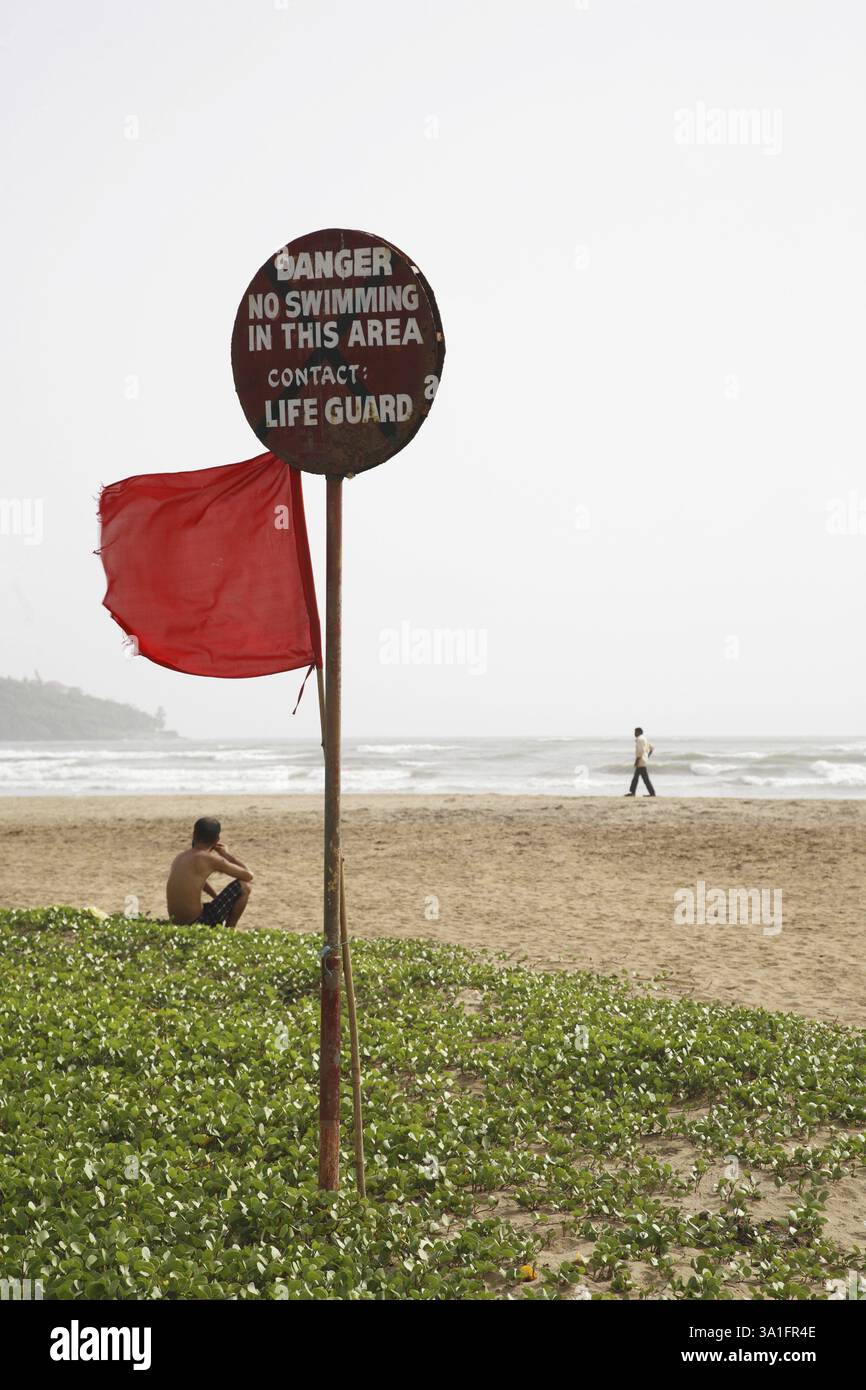 Red flag of danger swimming prohibited on Miranar beach, Goa, India ...