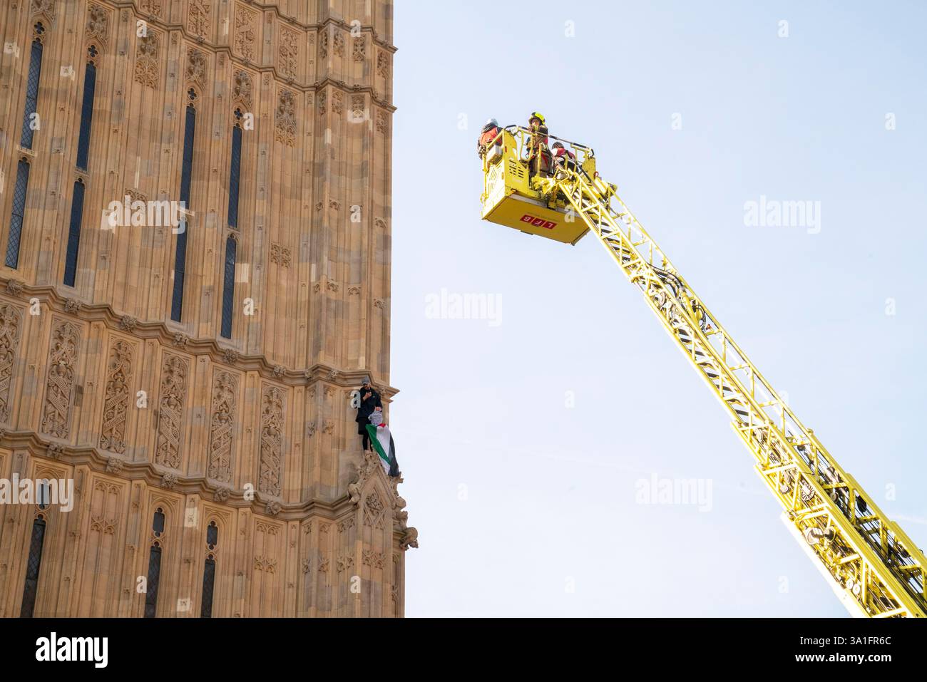 Protestor climbes the Elizabeth Tower to protest for the Filton 18 and ...