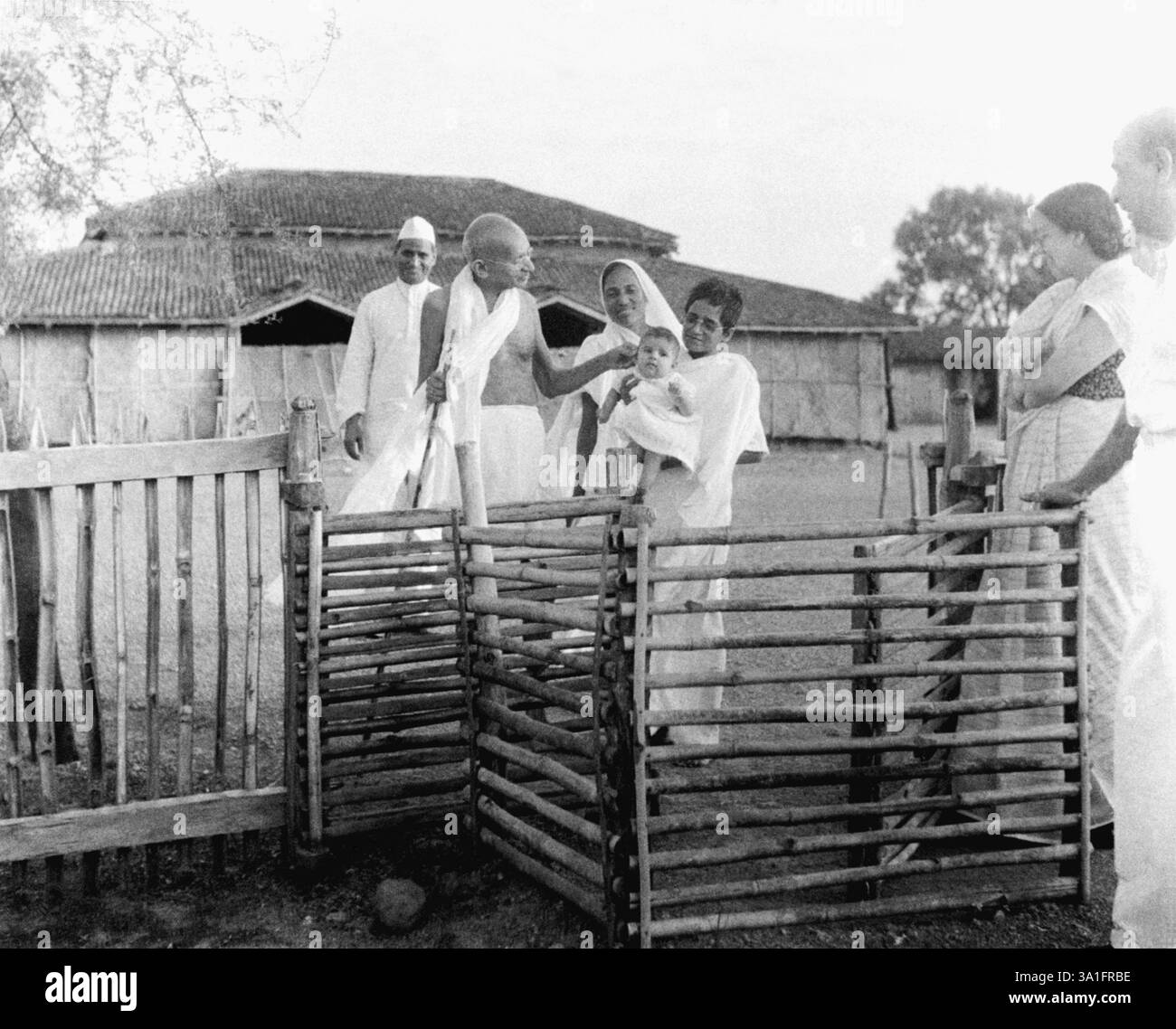 Mahatma Gandhi with Amtus Salam (holding a child) and Jankidevi Bajaj ...