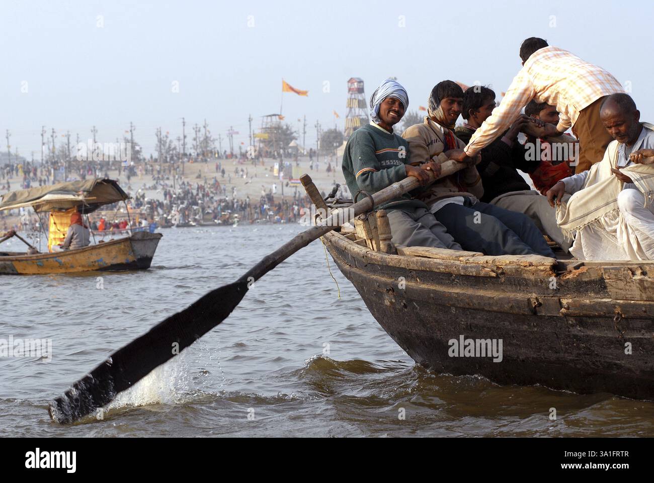 Boats ferry devotees at the confluence of the Ganges, Yamuna the ...