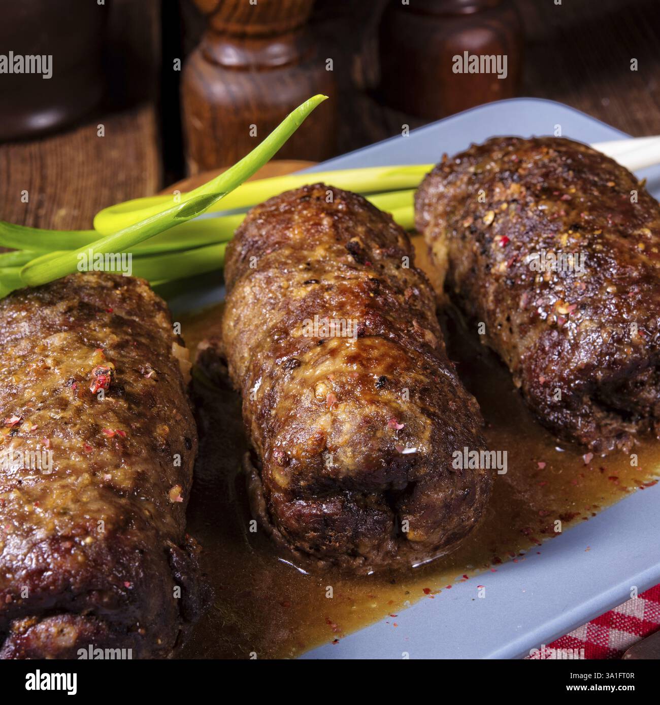 Baked beef roulades with delicious fillings Stock Photo - Alamy