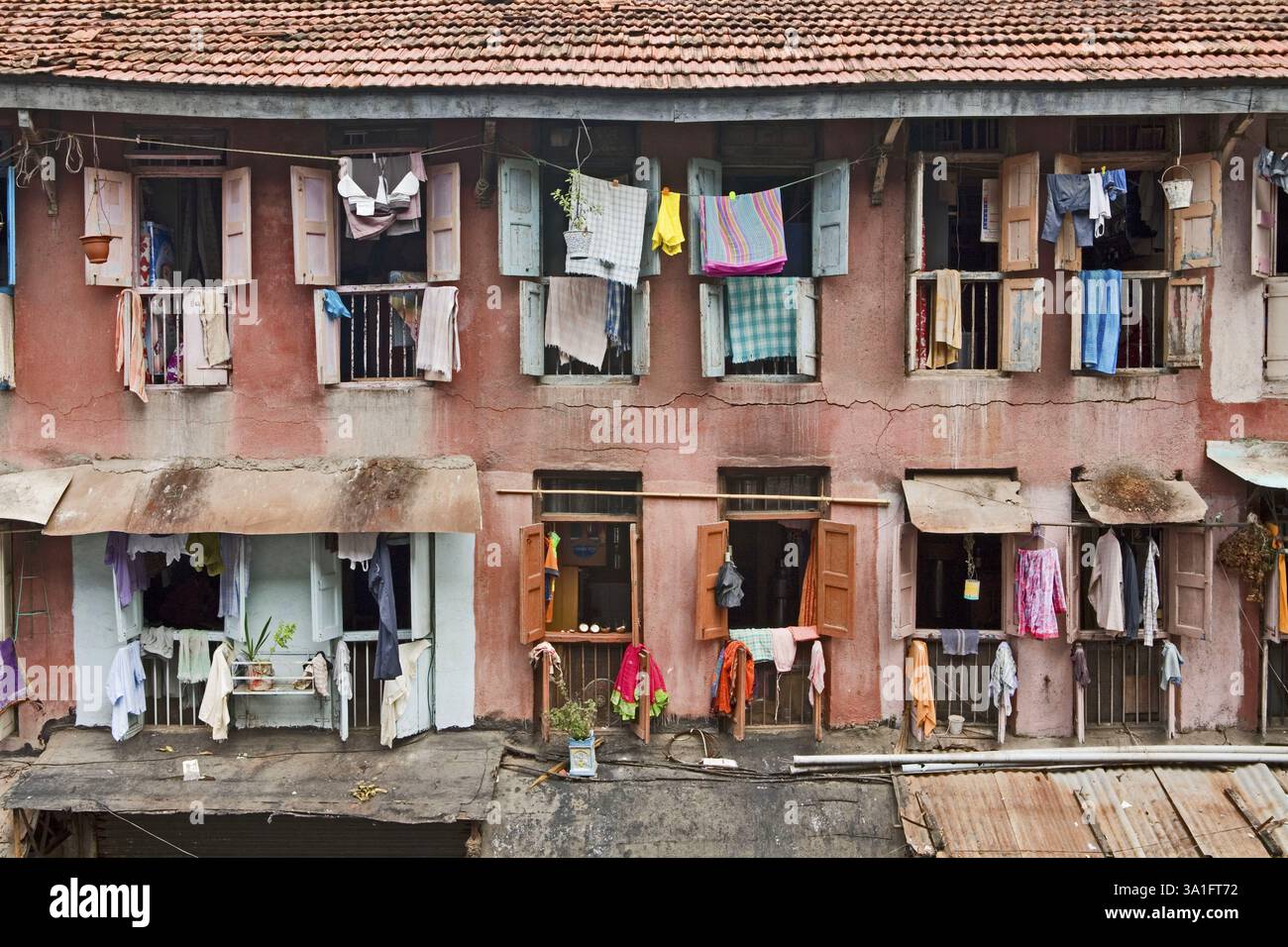 A 'chawl', single room housing complex with a common passage, with ...