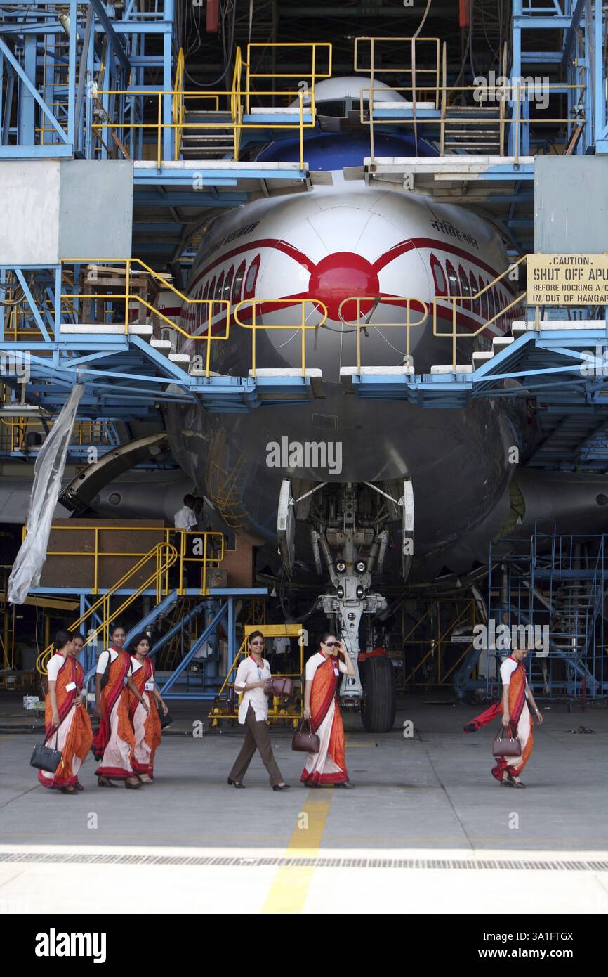 An airlines crew near Boeing 747-400 parked for maintenance and repair ...