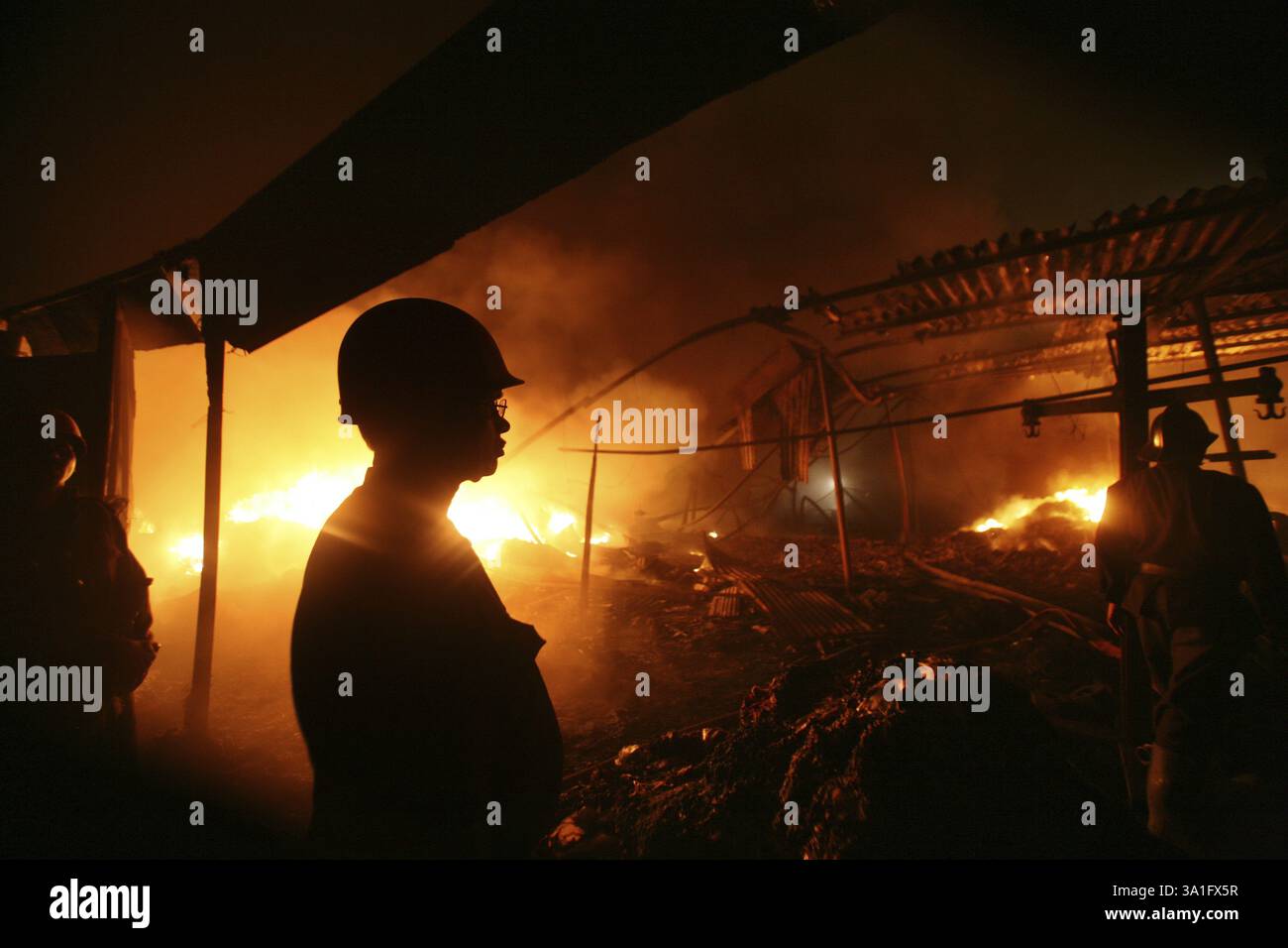 Fire men fighting the fire which broke inside a junkyard at Mandala in ...