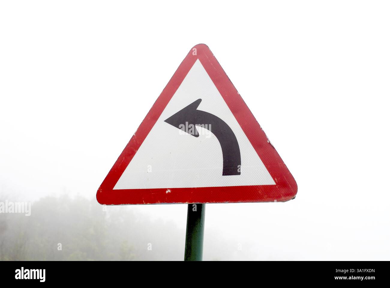 A road direction sign on a foggy day at tiger hills, Lonavala ...