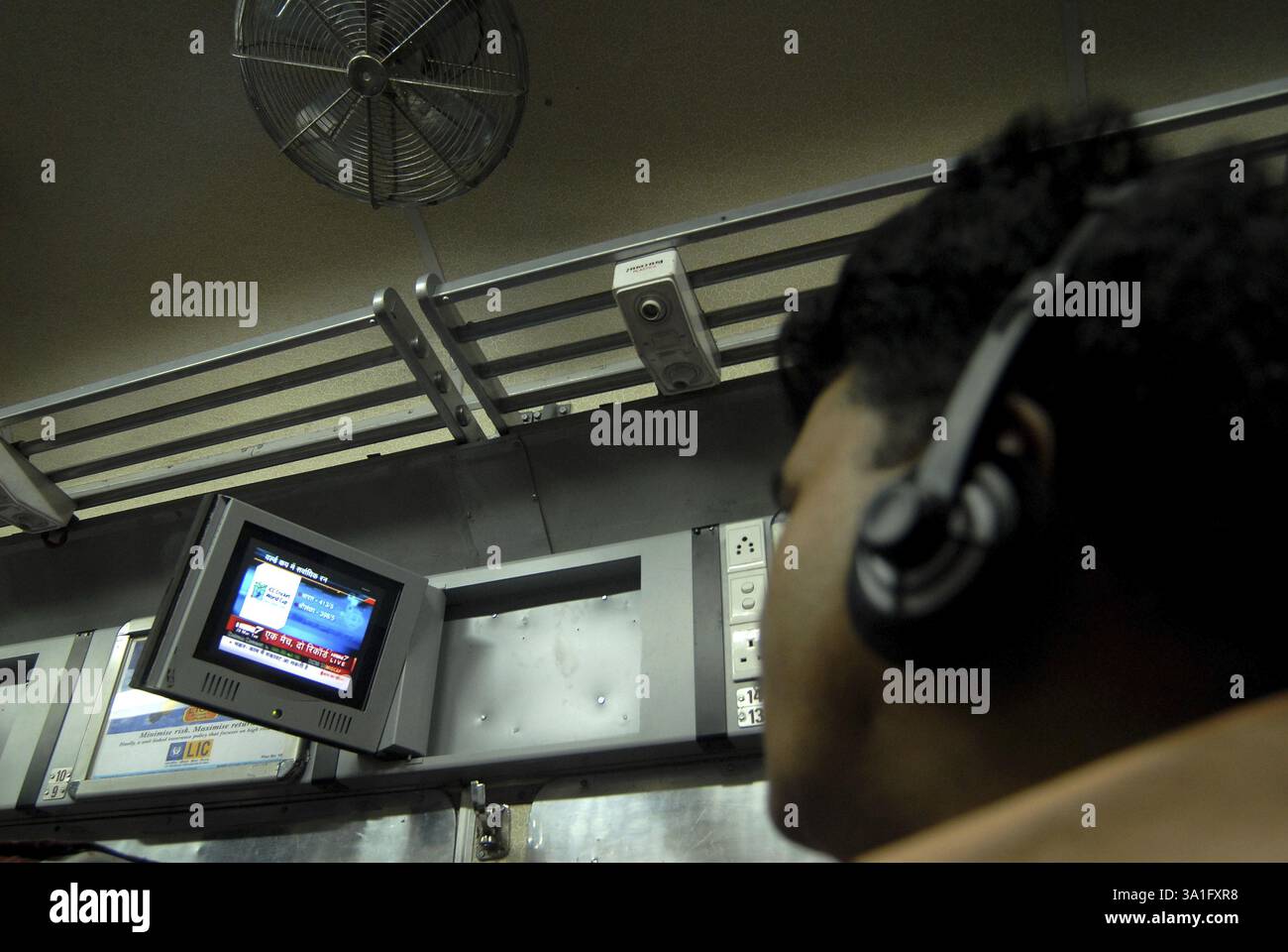 Passenger watching television introduce by Indian Railways on ...