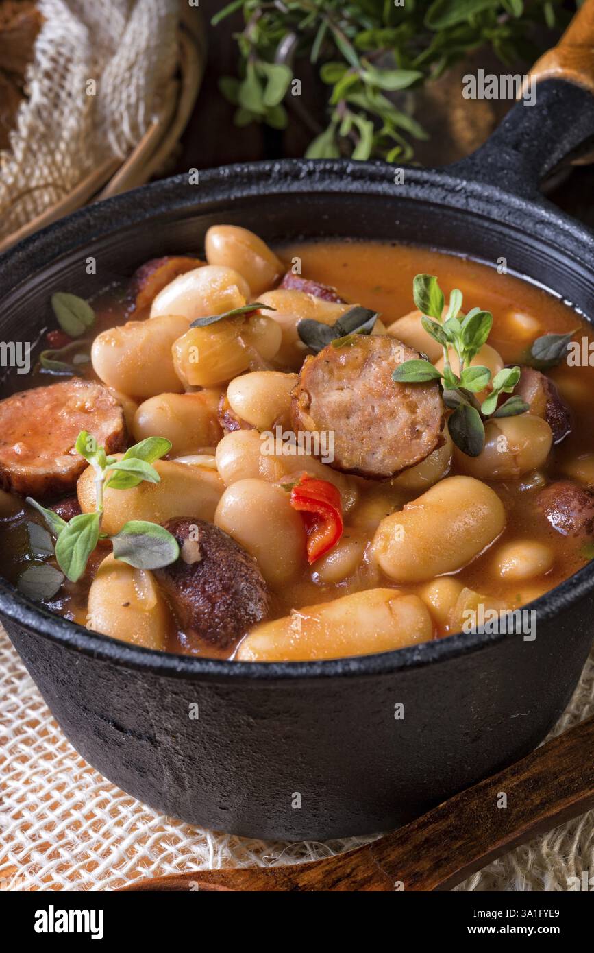 Polish baked beans with sausage Stock Photo - Alamy