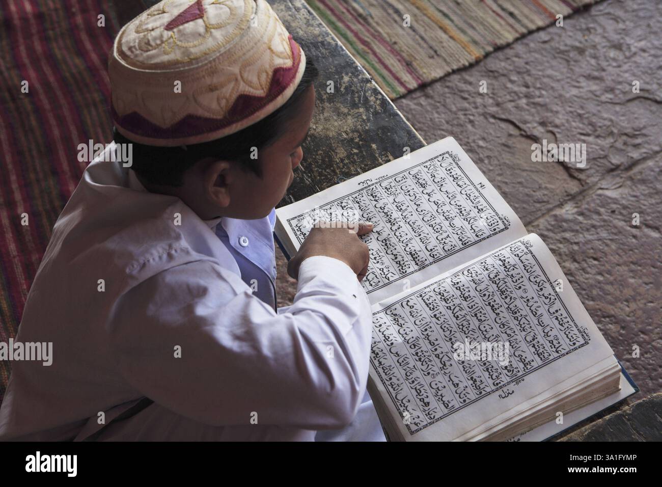 Muslim boy studying in in Urdu Muslim School classroom Madarasa in Jami ...