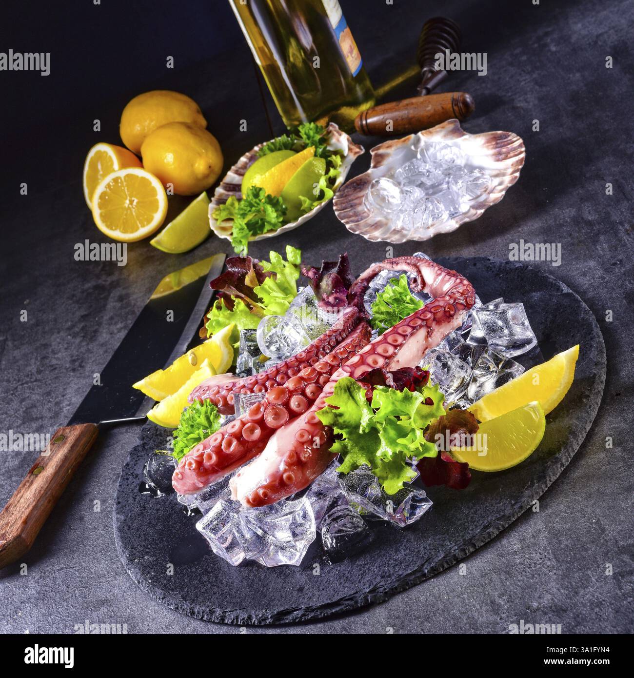 Raw octopus on the ice Stock Photo - Alamy