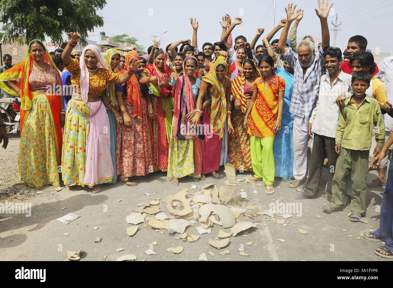 People protesting for water supply and breaking water pot on road ...