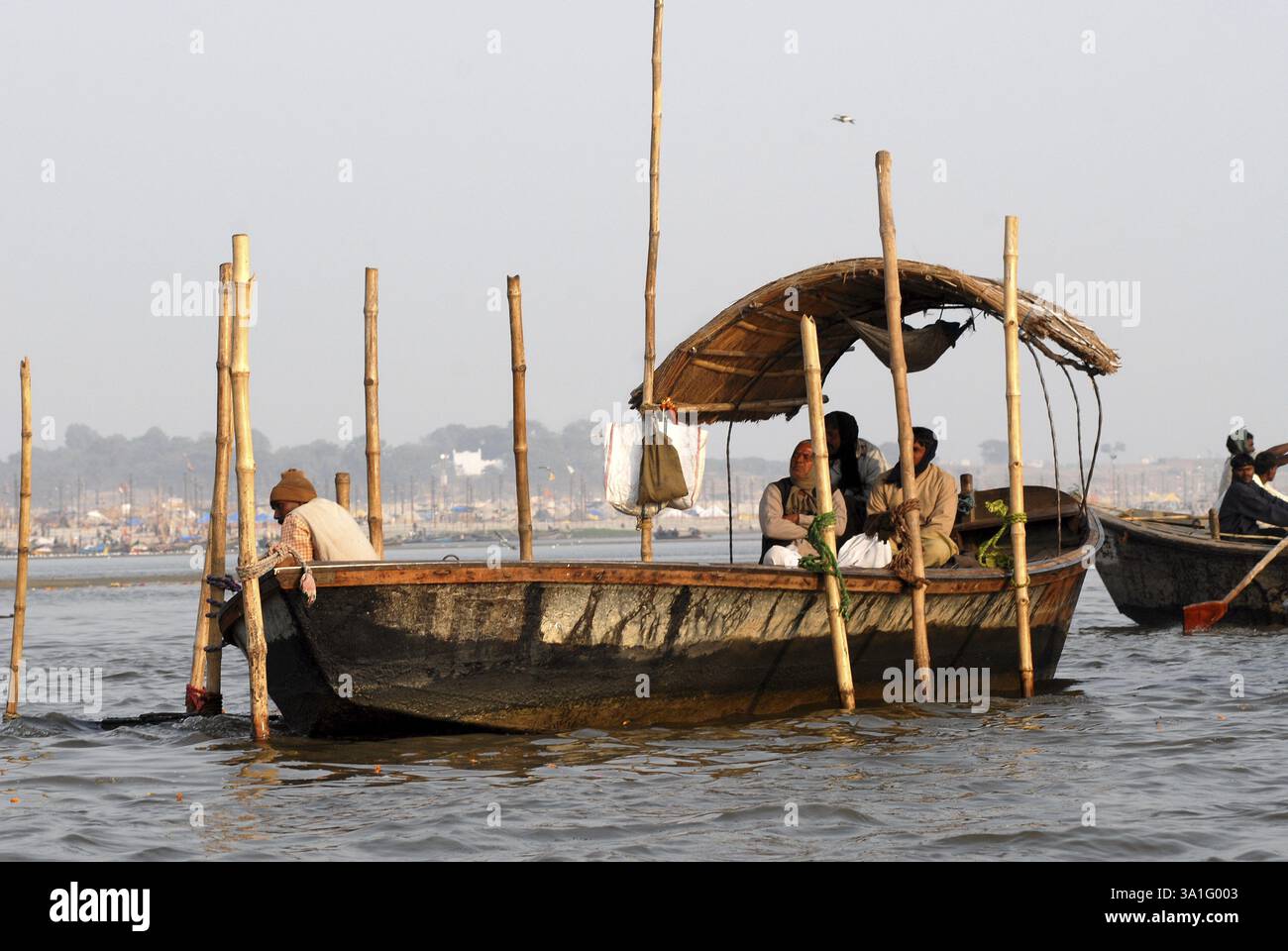 Boats ferry devotees at the confluence of the Ganges, Yamuna the ...