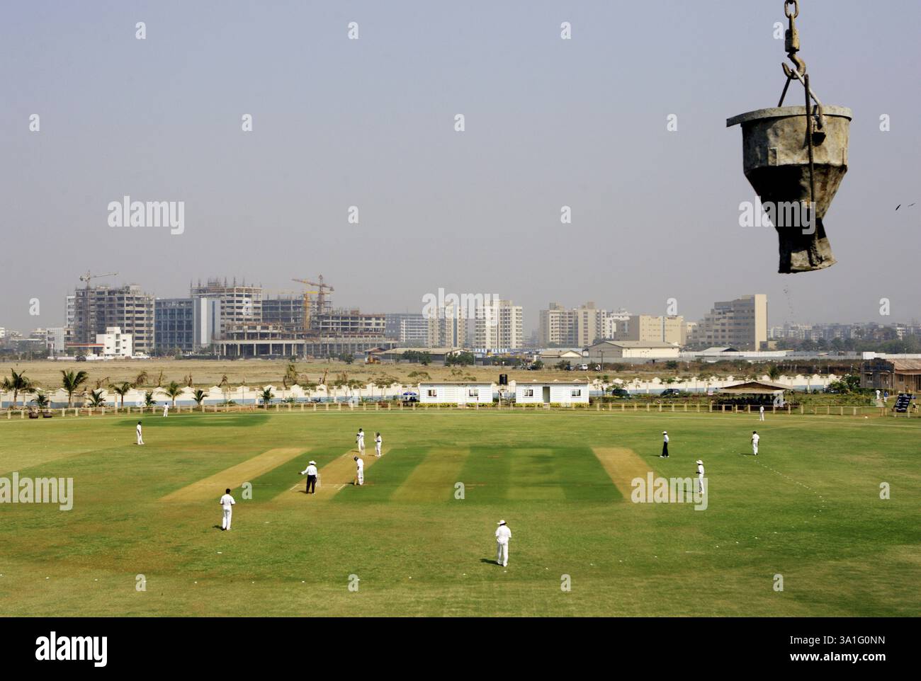 A practice cricket match is being played at the under construction ...
