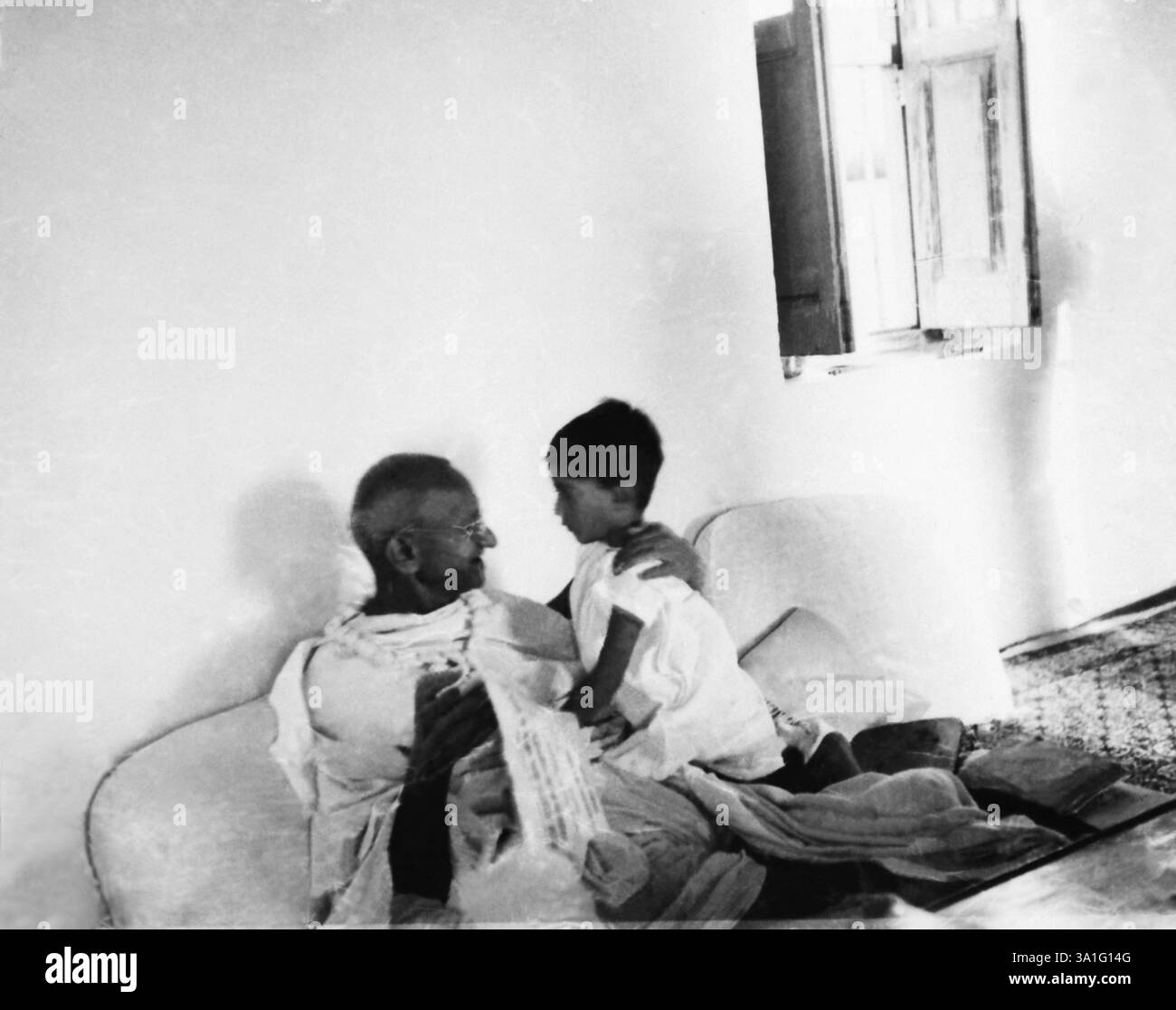 Mahatma Gandhi and his grandson Rajmohan on Gandhi's birthday at Birla ...