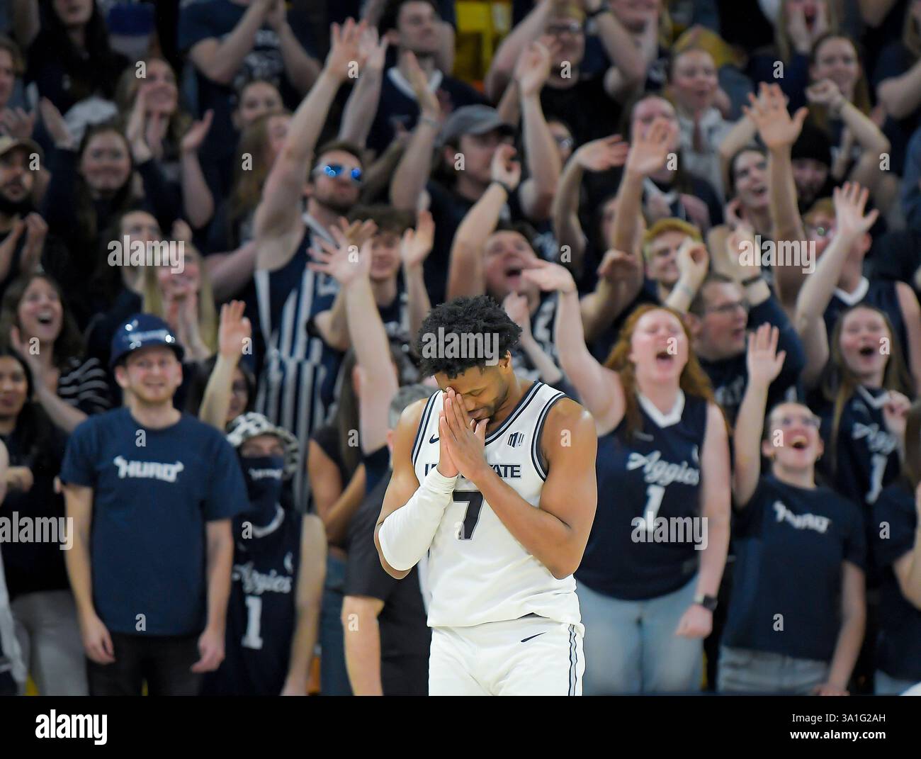 Utah State guard Dexter Akanno (7) reacts after scoring his 1000th ...