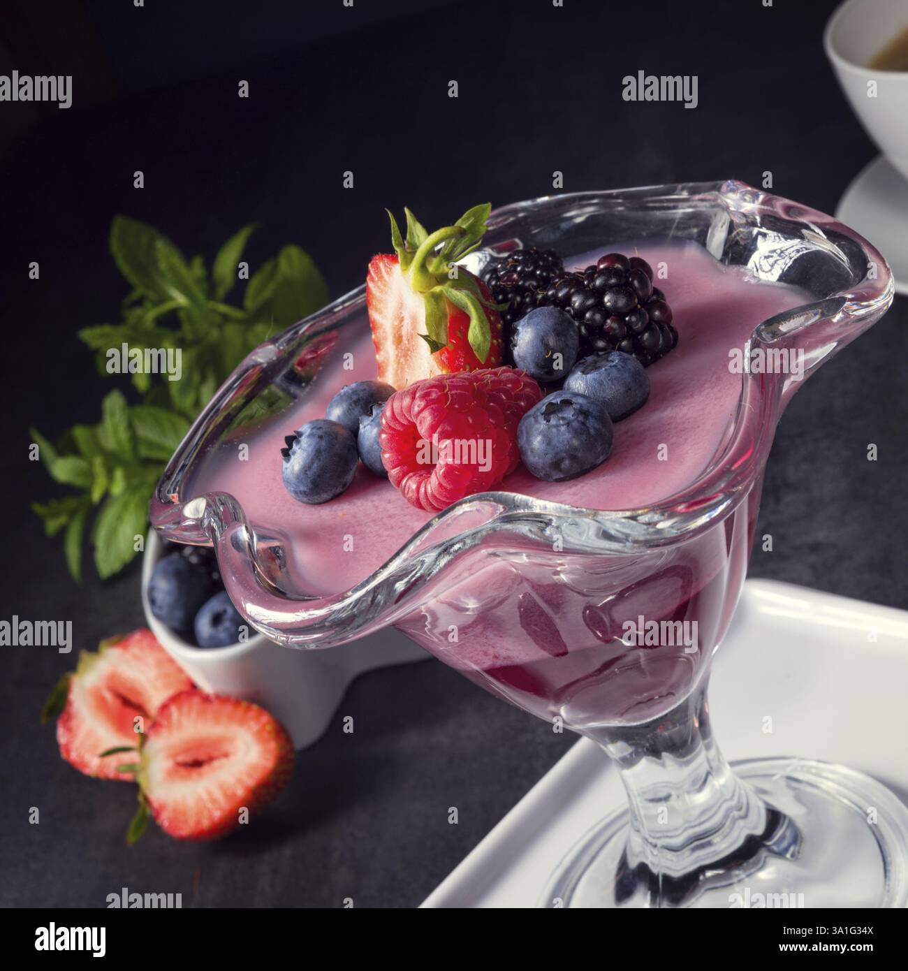Delicious pudding with wild berry Stock Photo - Alamy
