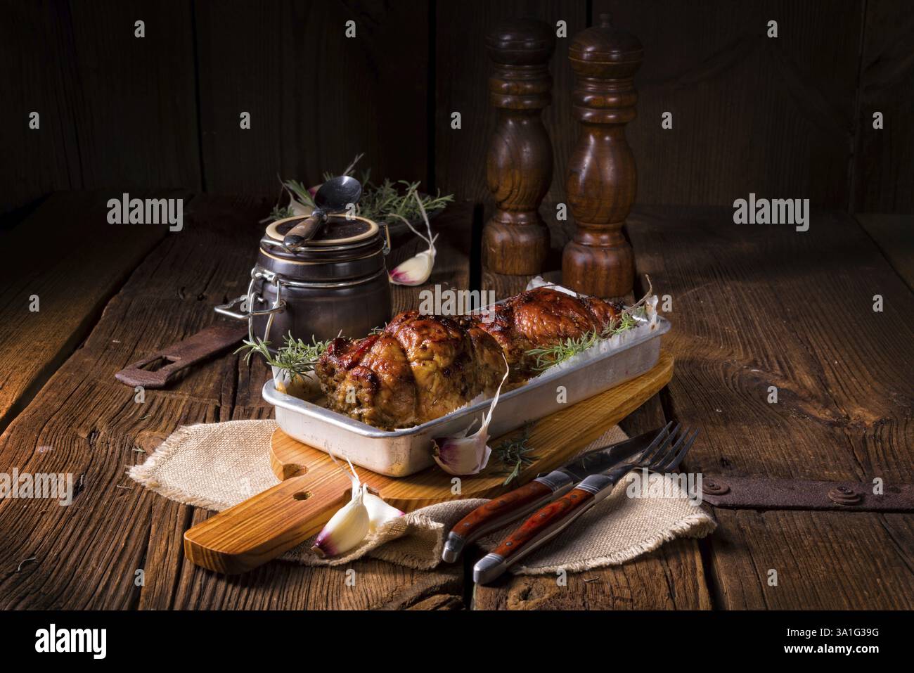 Small Rolling roasts fully with dried fruit and bacon Stock Photo - Alamy