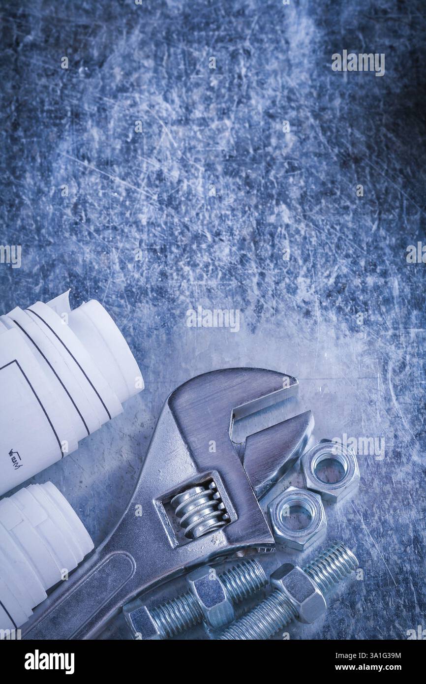 Metal adjustable wrench screw-nuts bolts and rolls of construction ...