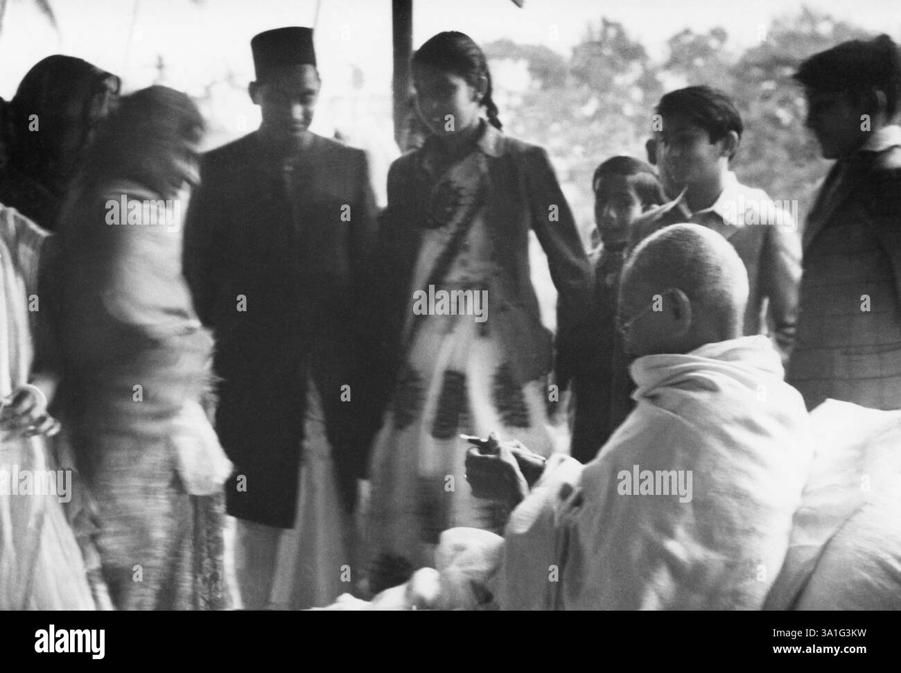 Mahatma Gandhi talking to members of Birla family at Khadi Pratishthan ...