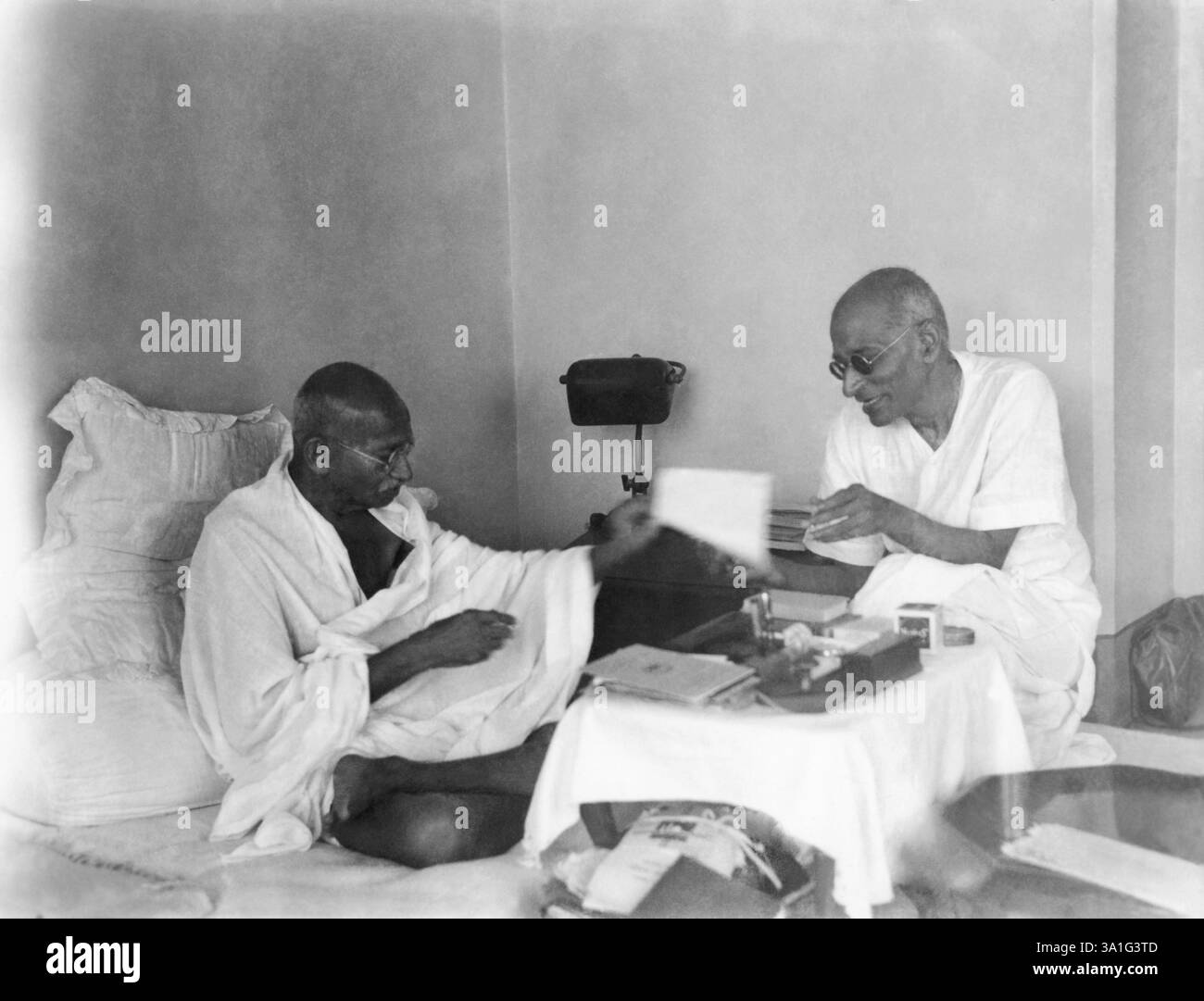 Mahatma Gandhi, handing over a letter/document to Chakravarti ...