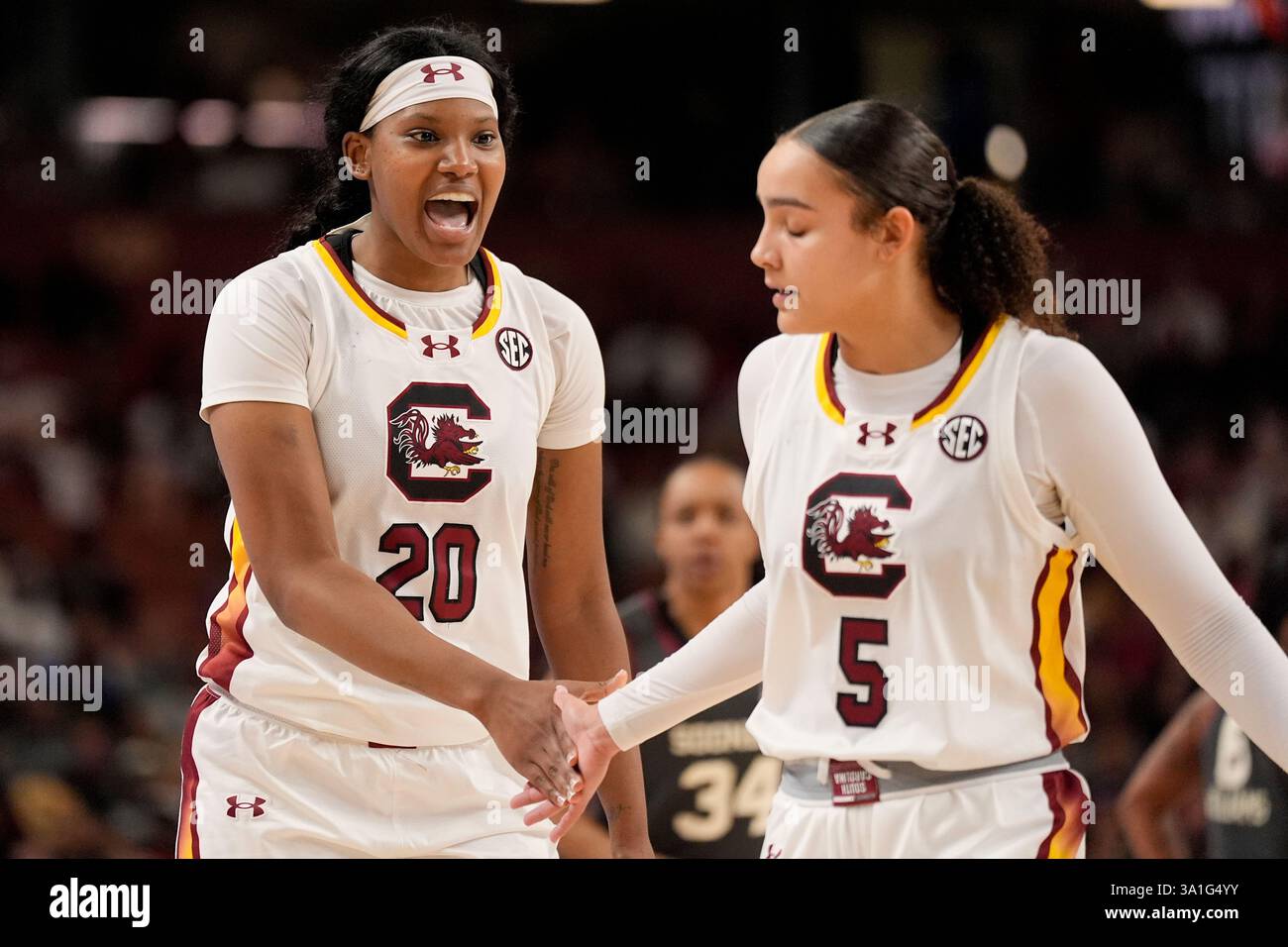 South Carolina forward Sania Feagin celebrates with guard Tessa Johnson ...