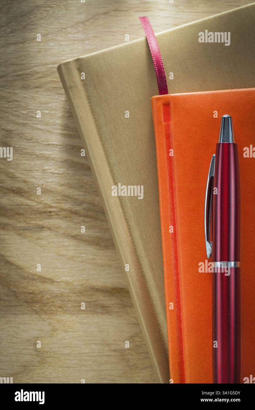 Office notebooks pen on wooden board Stock Photo - Alamy