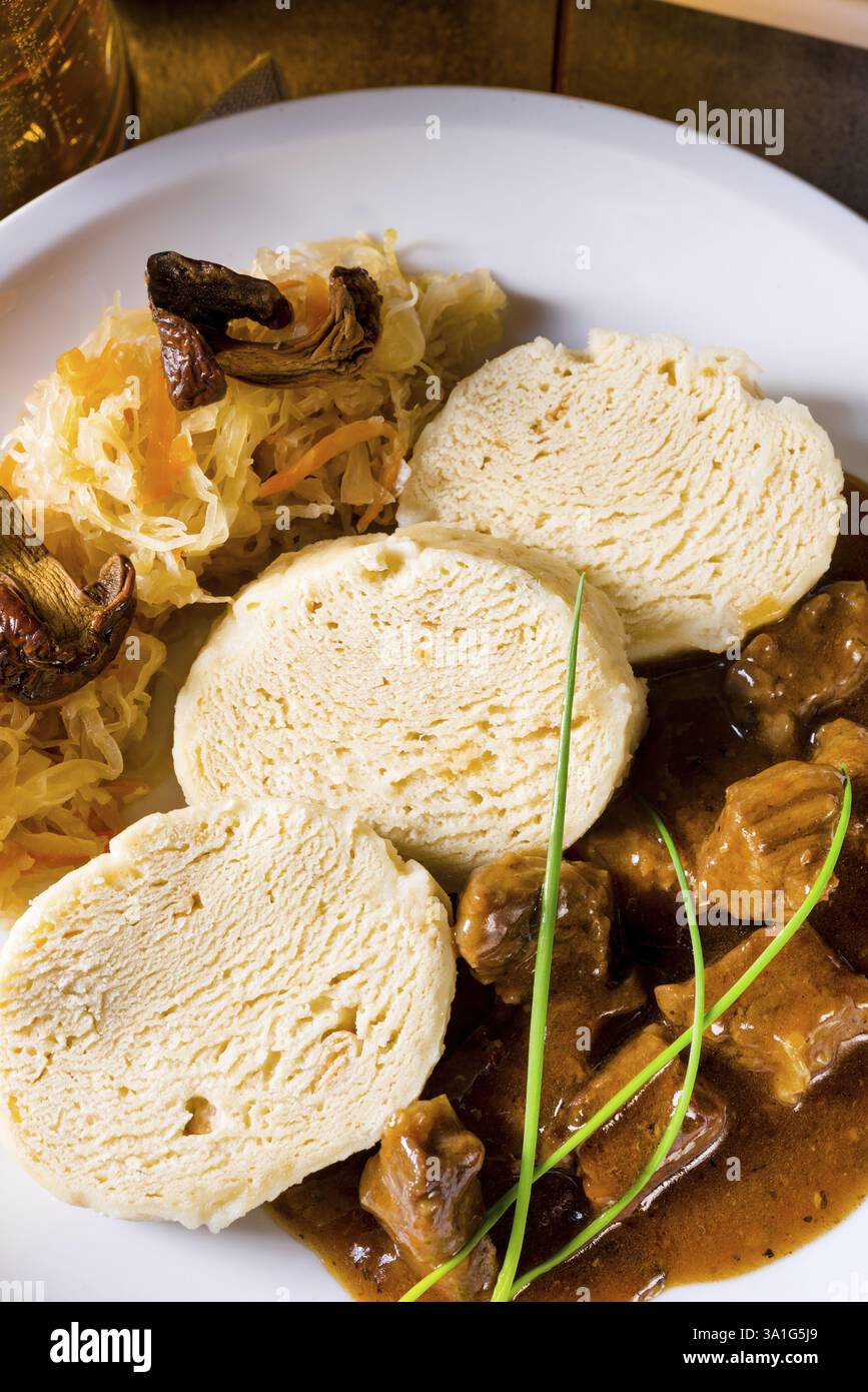 Original Czech dumpling with goulash Stock Photo - Alamy