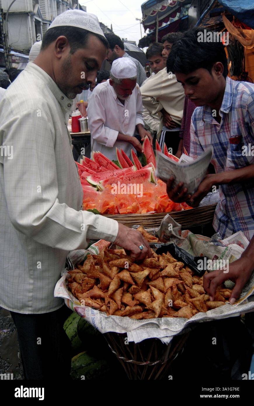 A food vendor prepare eatables as Muslims break their Ramzan or Ramadan ...
