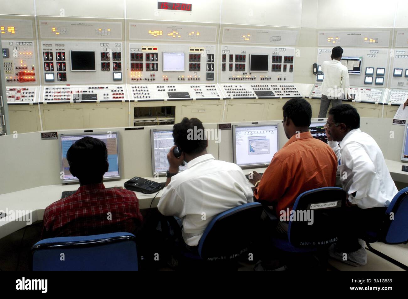 Men working on detail at control room of Tarapur Atomic Power station ...