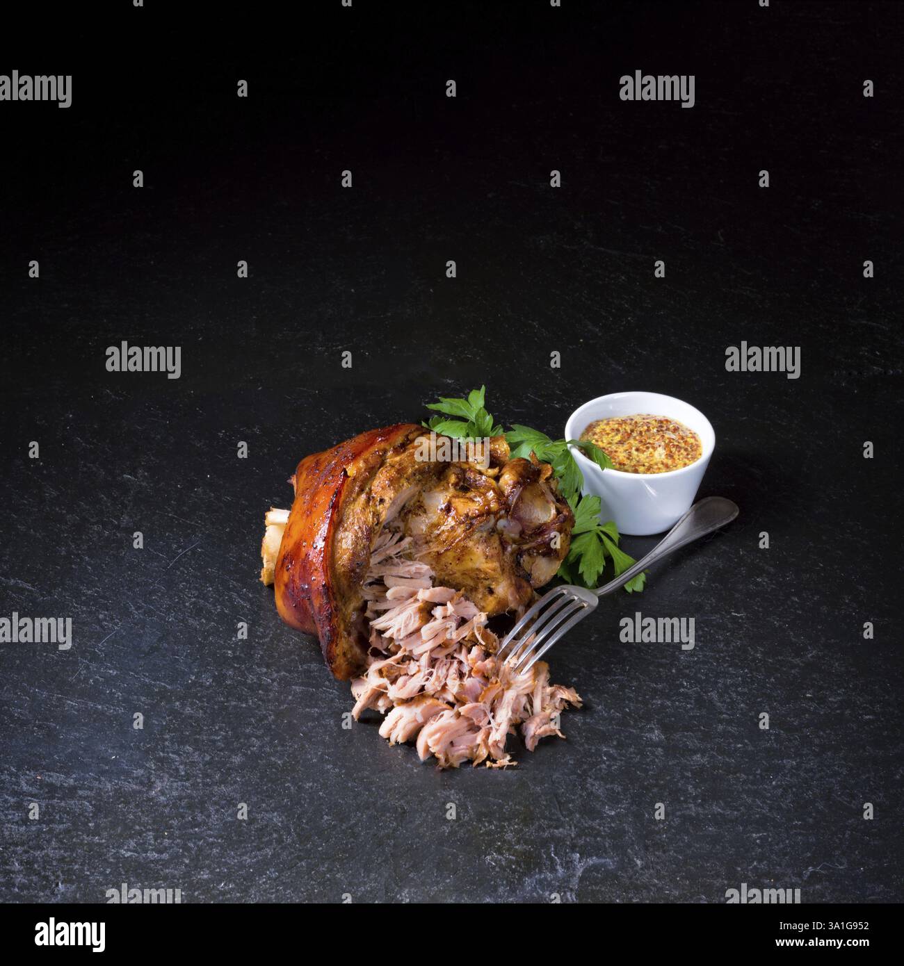 Fresh roasted knuckle of pork with mustard Stock Photo - Alamy