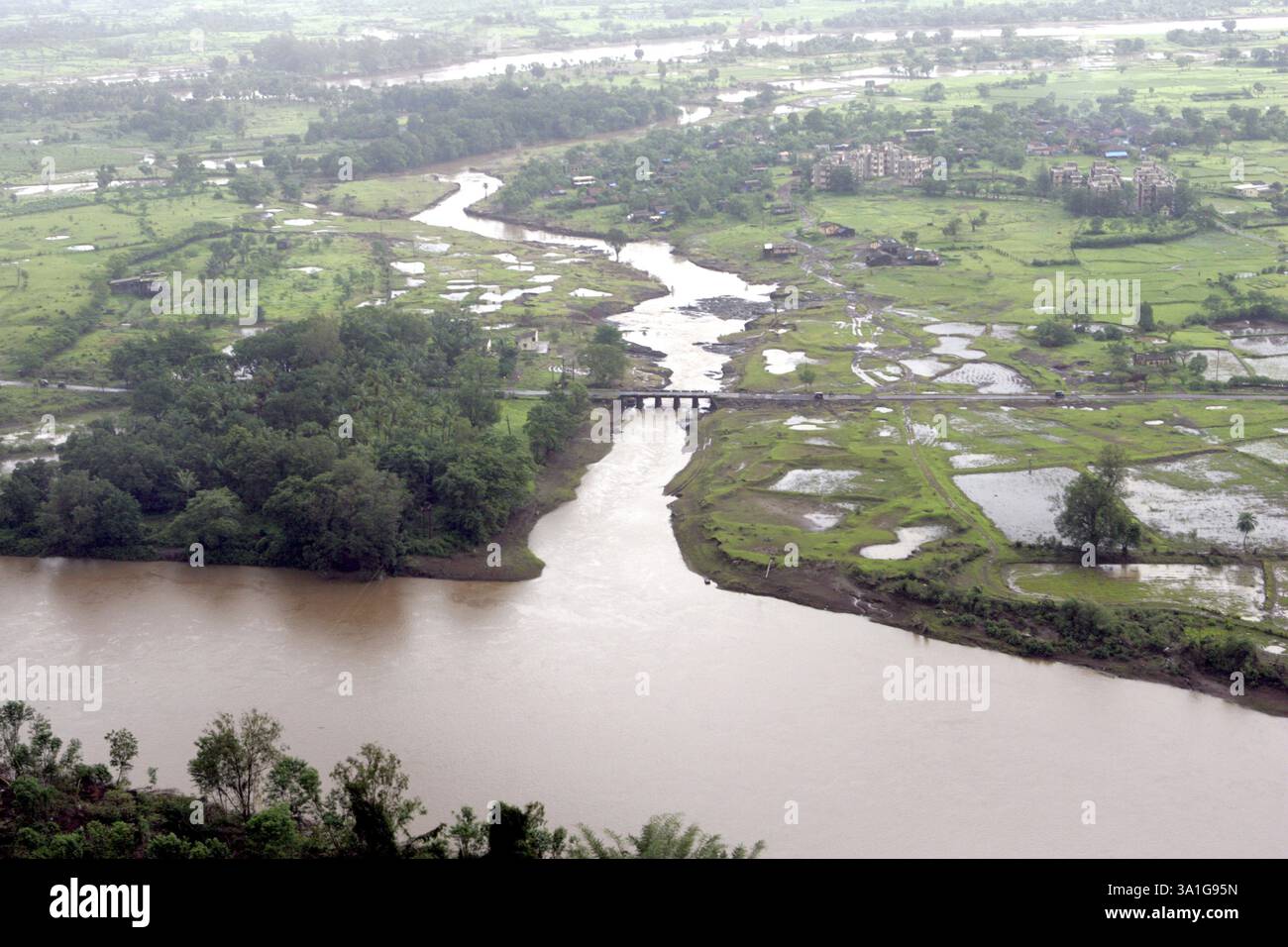 An aerial view of farming land immersed in water flood rocked in Raigad ...