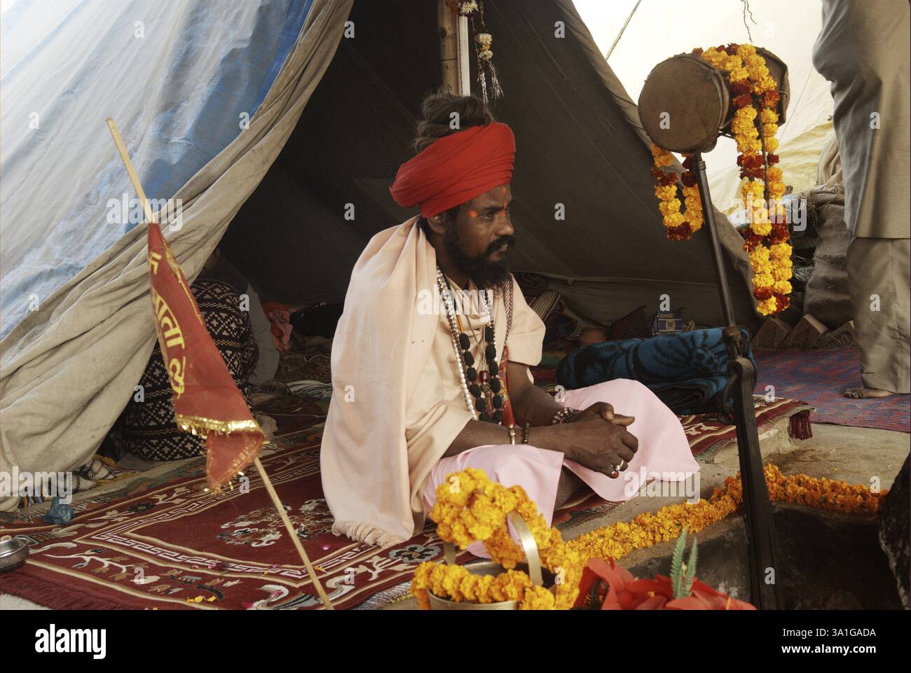 A naga sadhu from the Juna Akadha at his camp during the Ardh Kumbh ...