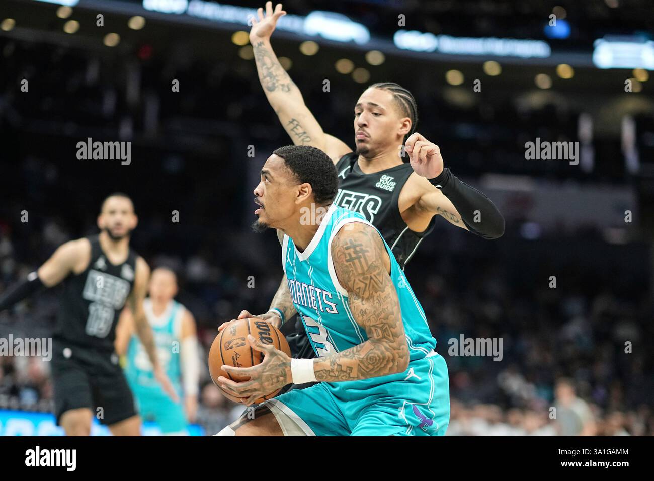 Charlotte Hornets guard DaQuan Jeffries (3) is defended by Brooklyn ...